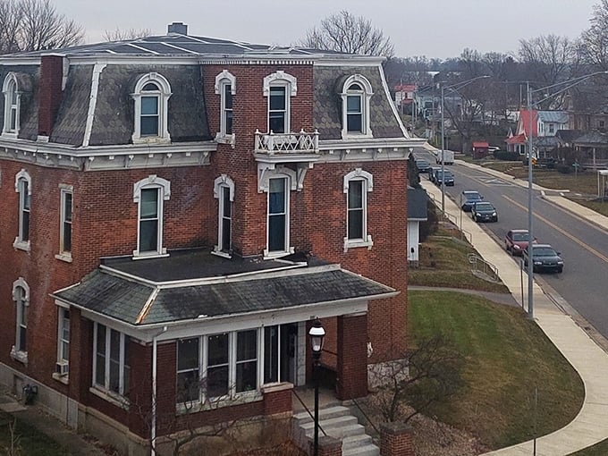 Historic brick mansion overlooks Greenville's quiet streets, showcasing the town's architectural heritage and peaceful atmosphere.