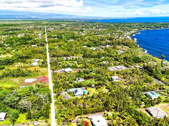 Hawaiian Paradise Park's eastern side reveals a patchwork of homes tucked into nature's embrace, where jungle meets residential living.