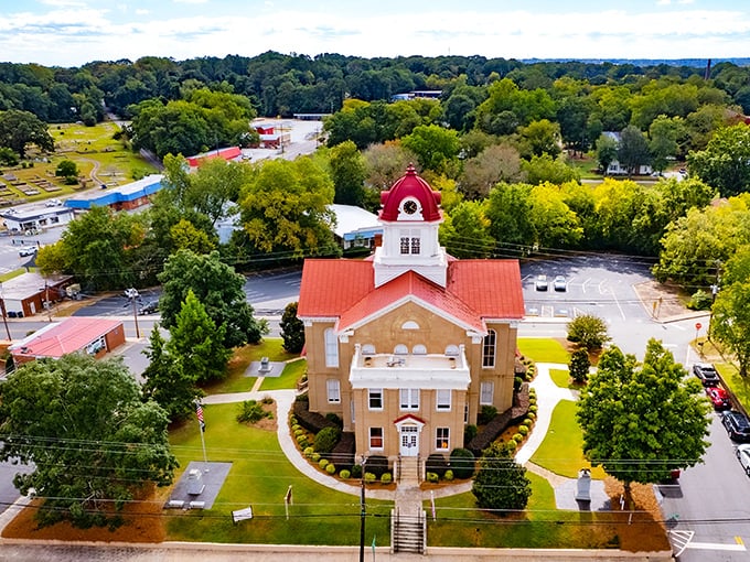 The stately courthouse stands as Jefferson's crown jewel, its red roof and white clock tower watching over generations of small-town stories.