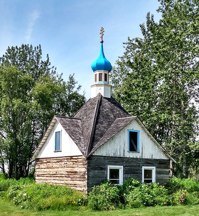 The historic Saint Nicholas Memorial Chapel in Kenai stands as a blue-domed sentinel watching over generations of fishing families.