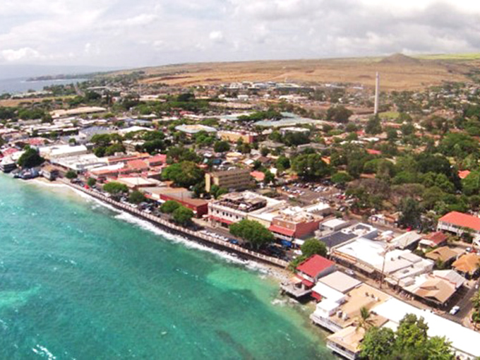 The aerial view of Lahaina shows how the town nestles perfectly between mountain and sea. Geography doesn't get more perfect than this.