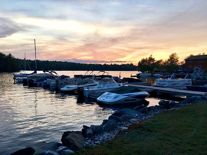 Sunset paints the marina with golden hues as boats rest peacefully&mdash;a daily spectacle that Millinocket retirees never take for granted.