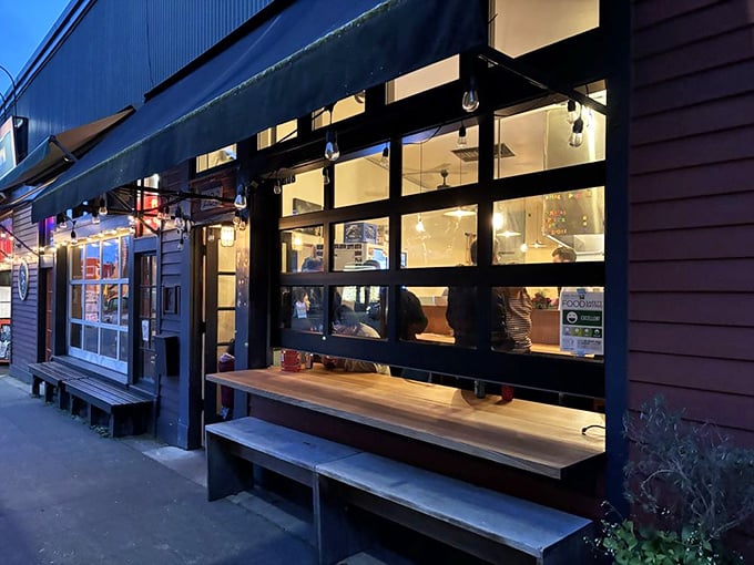 The evening glow transforms this humble pizza spot into the kind of place where memories are made, one slice at a time.