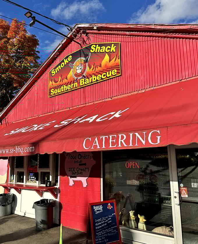 Fall colors complement the Smoke Shack's vibrant red facade. A roadside beacon of hope for the hungry traveler.