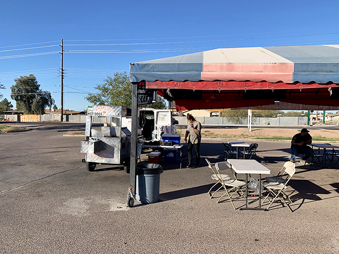 Under the red and white tent, magic happens. Sonora Querida's setup is simple, but their hot dog game is championship level.