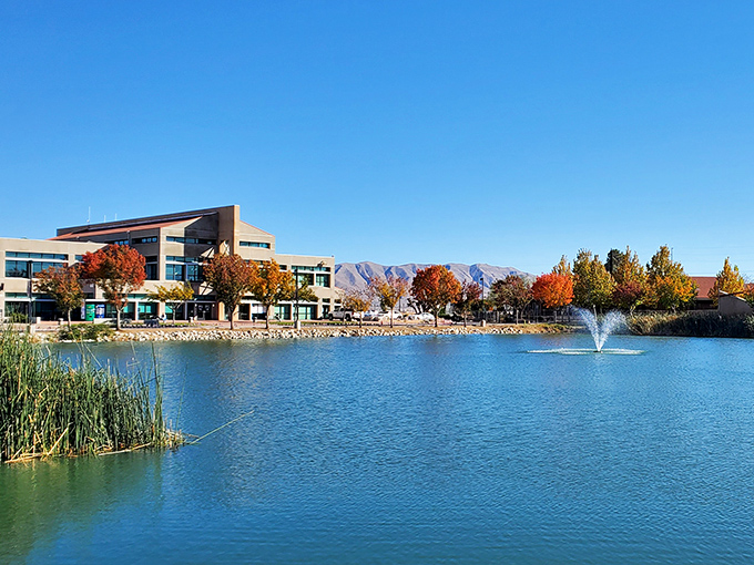 Serene waters reflect modern buildings in Victorville, where desert living combines affordability with surprising natural beauty.