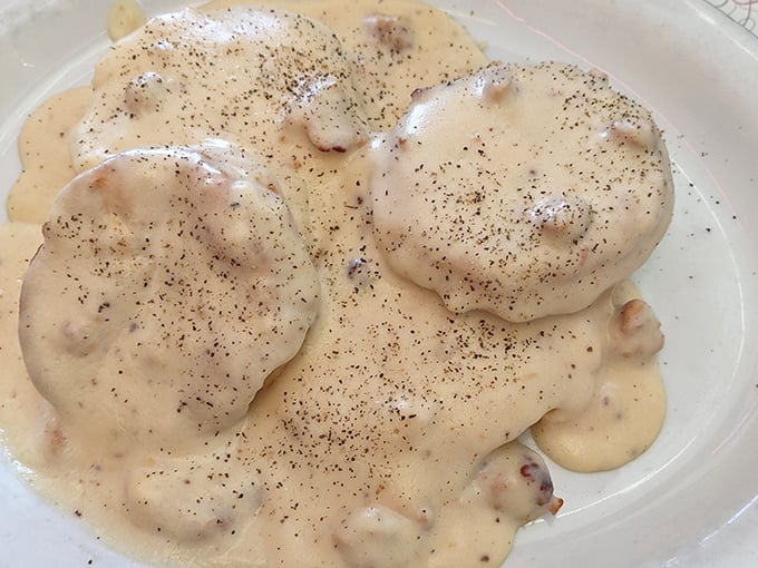 Biscuits swimming in creamy pepper-flecked gravy&mdash;comfort food that whispers "take a nap after this" with every bite.
