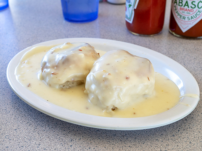 Biscuits and gravy that would make your Southern grandmother weep with joy, smothered in a peppery cream sauce that demands to be sopped up.