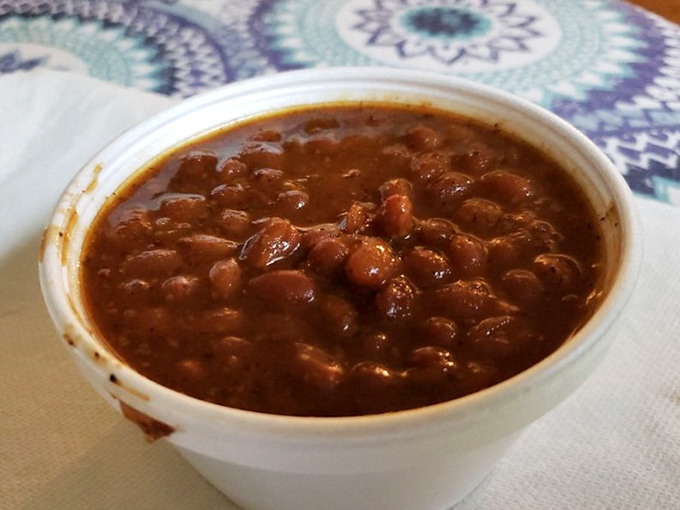 These baked beans aren't just a side dish&mdash;they're a supporting actor that deserves its own award, studded with smoky bits that tell tales of the pit.
