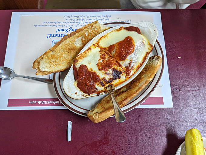 This isn't just baked lasagna &ndash; it's layers of history, cheese, and sauce that would make any nonna nod in approval while reaching for a second helping.