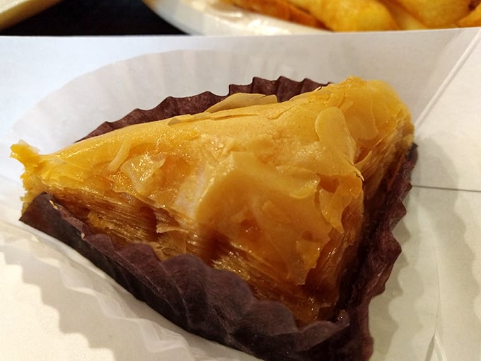Layers of honey-soaked phyllo cradle nuts in this perfect baklava. Each bite shatters then melts, like the world's most delicious structural collapse.