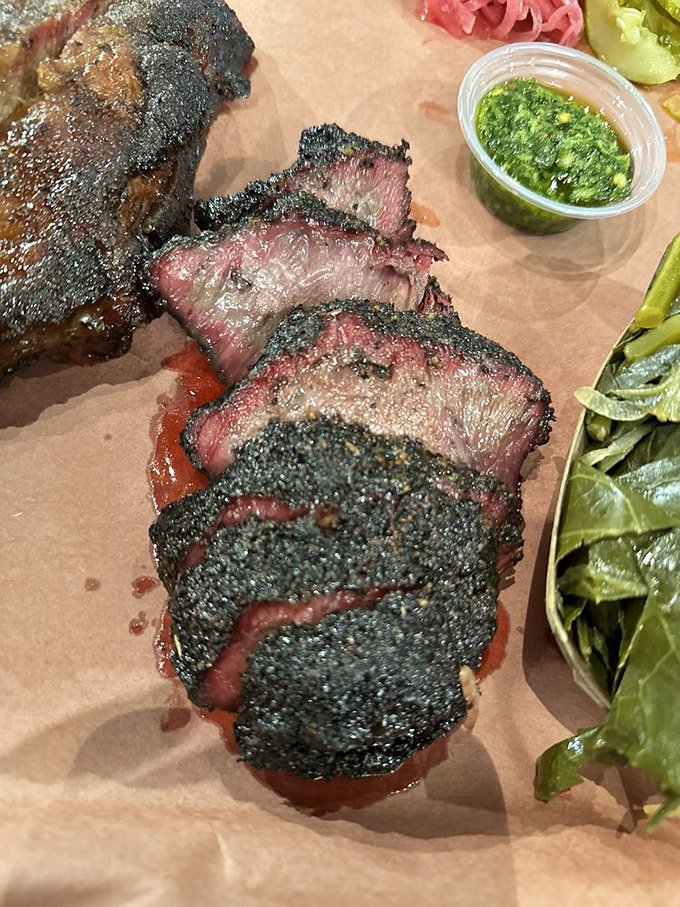These brisket slices flaunt their smoke rings like Olympic medals. The bark alone deserves its own championship parade.