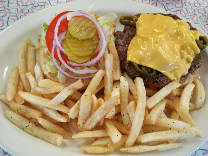 This burger doesn't just come with fries; it arrives with an entourage of crispy golden potatoes worthy of their own fan club.