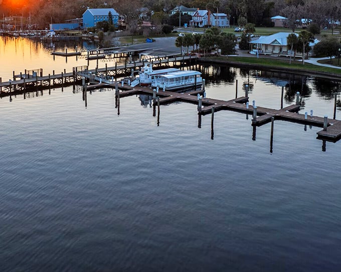 Sunset transforms the marina into a watercolor painting, where boats rest after a day of adventures on "America's Amazon."