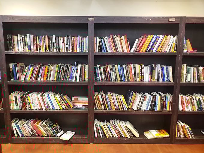 The book section is a literary buffet where dog-eared paperbacks and forgotten bestsellers offer mental journeys for less than the price of a latte.