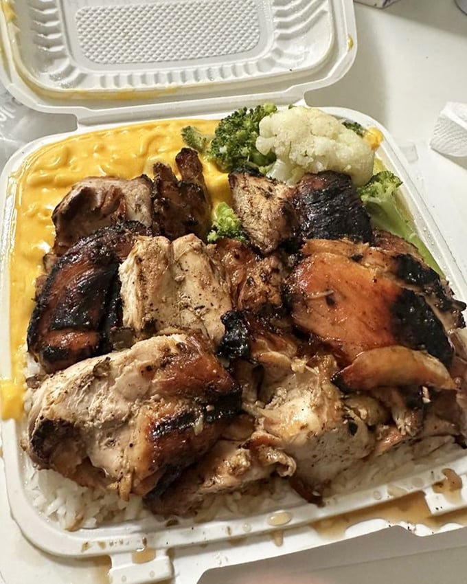 The star of the show: bourbon chicken with veggies over rice. That caramelized glaze has the kind of depth usually reserved for philosophical discussions.