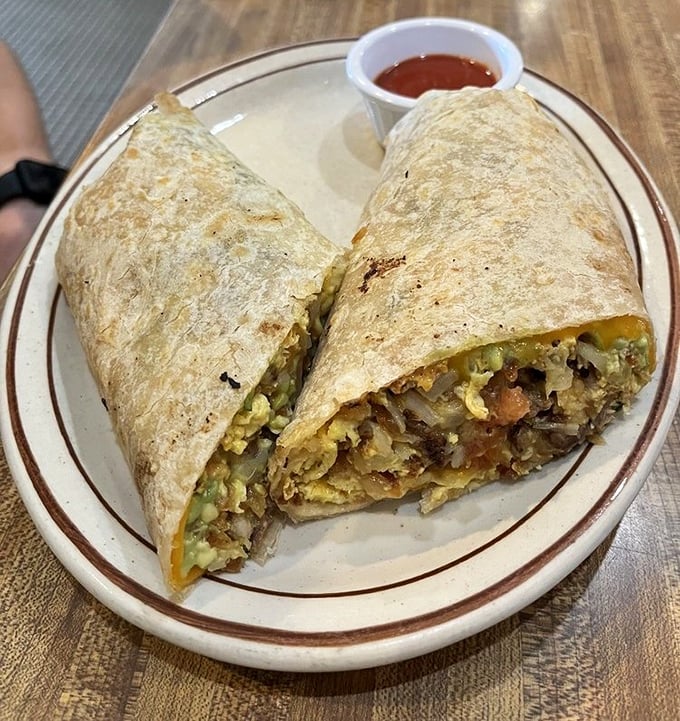 That breakfast burrito is packed tighter than a carry-on bag, stuffed with everything you need to start your day right.
