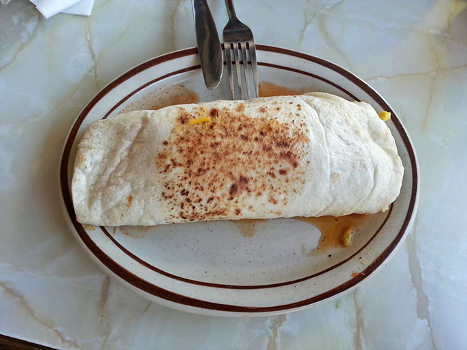 The breakfast burrito&mdash;New Mexico's gift to humanity. Grilled to perfection with that distinctive speckled exterior that whispers, "There's green chile inside."