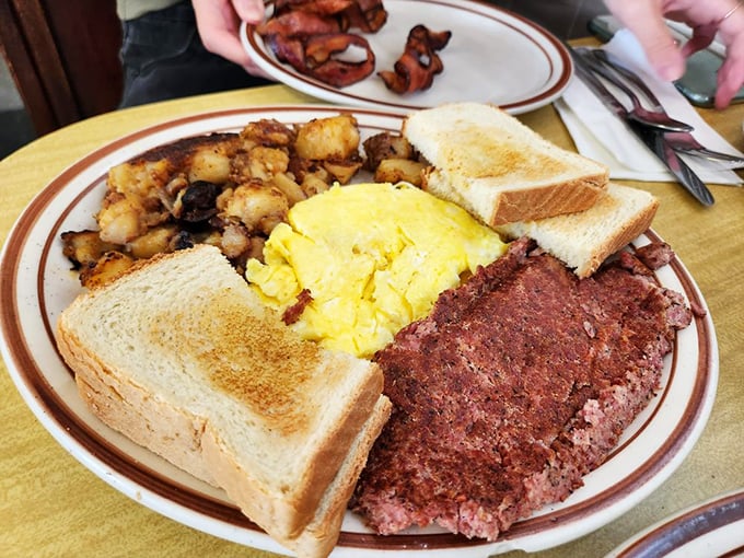 The holy trinity of breakfast: golden toast, scrambled eggs, and corned beef hash that's been on more Rhode Island plates than the state bird.