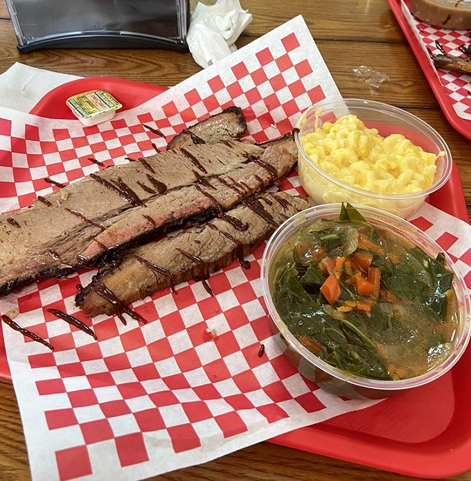 Brisket sliced so perfectly you could frame it, paired with mac and cheese that would make your grandmother question her recipe.