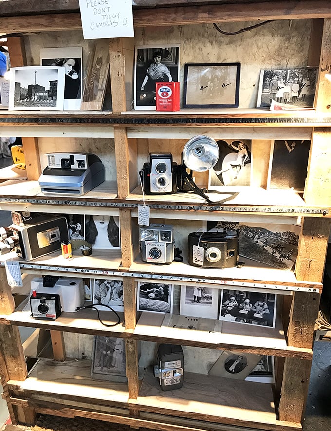A time-traveling shelf of vintage cameras and photographs. For when your iPhone pics just aren't giving you enough street cred.