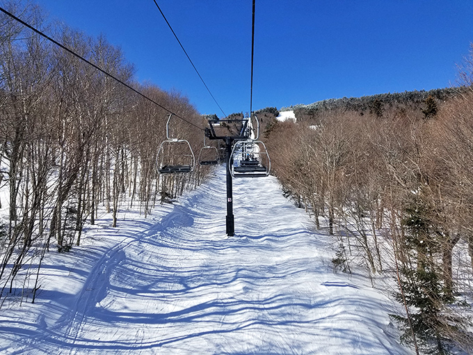 The scenic route to adventure. This chairlift doesn't just transport you up the mountain—it delivers front-row seats to Vermont's breathtaking panorama.