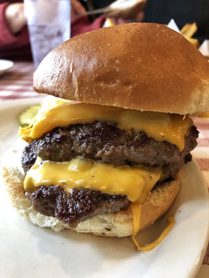 This double cheeseburger isn't just a meal, it's an architectural marvel of beef and melted American cheese that would make any Midwesterner proud.