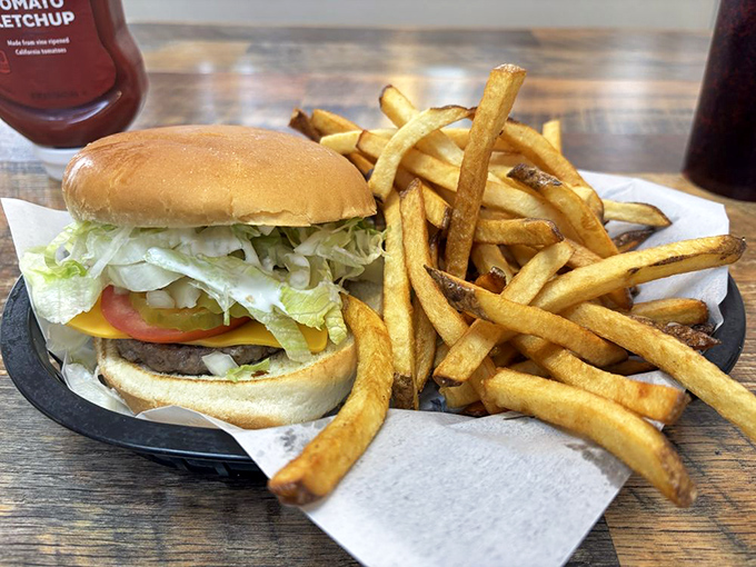 This isn't just any cheeseburger&mdash;it's the kind that makes you wonder why you ever bothered with fancy restaurants. Golden fries, melty cheese, and pure satisfaction on a plate.