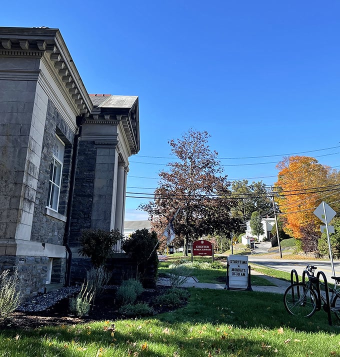 This stately stone building isn't just Chester's library&mdash;it's where knowledge meets New England craftsmanship under a perfect autumn sky.