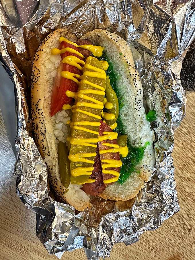 The Chicago Dog arrives dressed for success with its poppy seed bun and electric green relish. No ketchup in sight&mdash;as the hot dog gods intended.