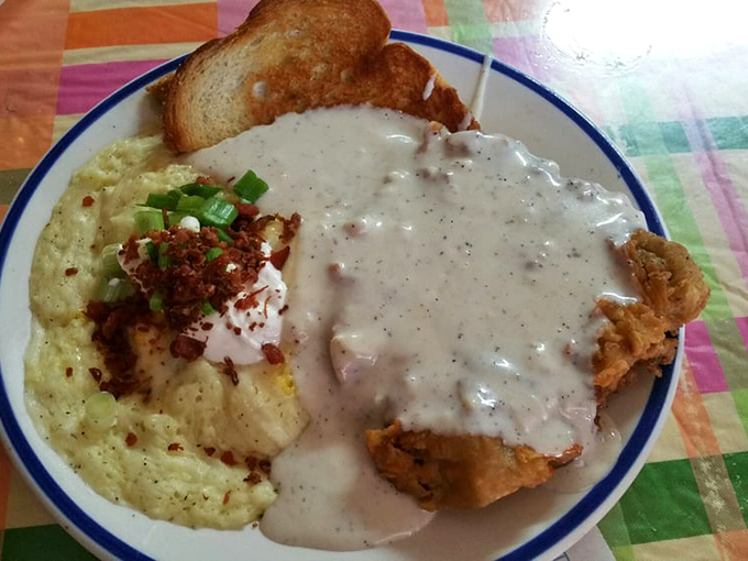 Southern comfort on a plate. The chicken fried steak with creamy gravy and sides is what dreams are made of.