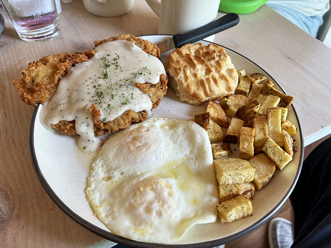 Chicken fried steak smothered in creamy gravy with a side of sunshine&mdash;comfort food that would make even Dracula rise before sunset.
