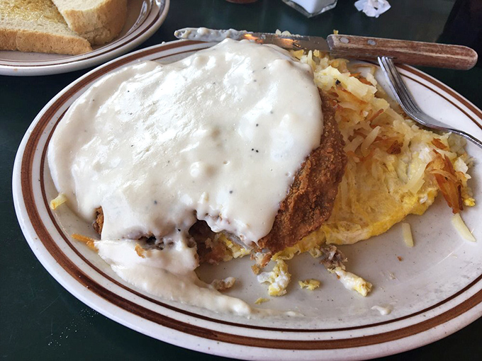 Country gravy cascading over crispy chicken fried steak like a delicious avalanche. The hash browns aren't playing second fiddle&mdash;they're co-headlining this breakfast concert.