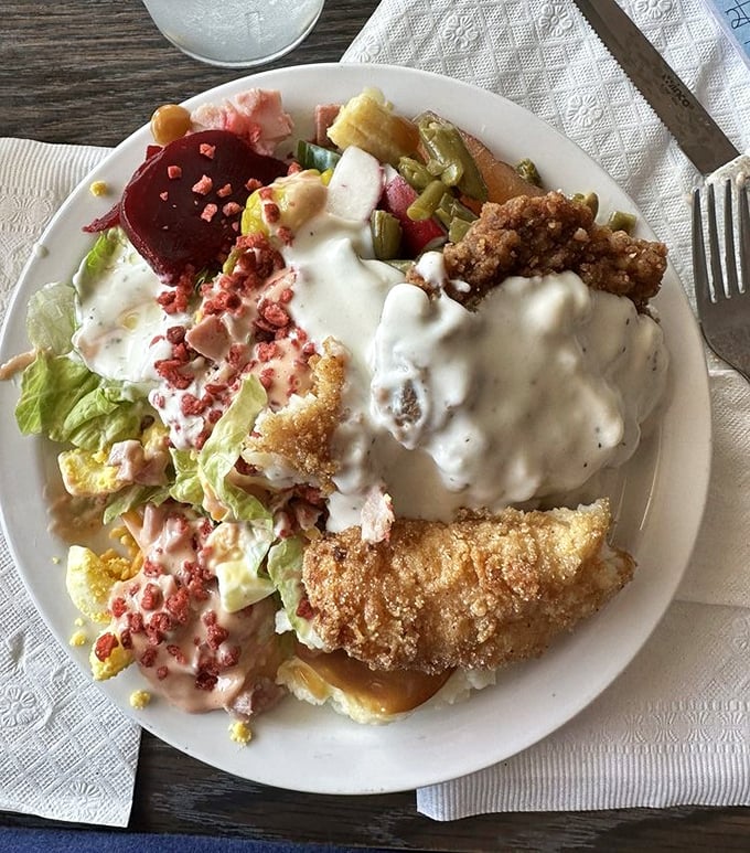 A plate that screams "Kentucky comfort" &ndash; country fried steak smothered in pepper-flecked gravy with all the fixings your grandmother would approve of.