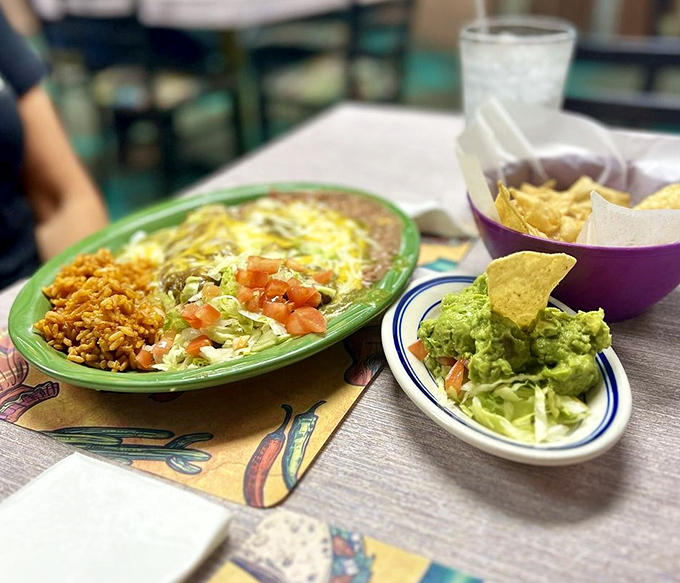 A plate that doesn't know the meaning of restraint. Rice, beans, and guacamole playing supporting roles to the real star&mdash;that cheese-covered masterpiece.