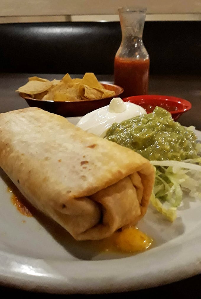 This golden chimichanga arrives crispy and piled with toppings&mdash;comfort food wrapped in pure happiness.