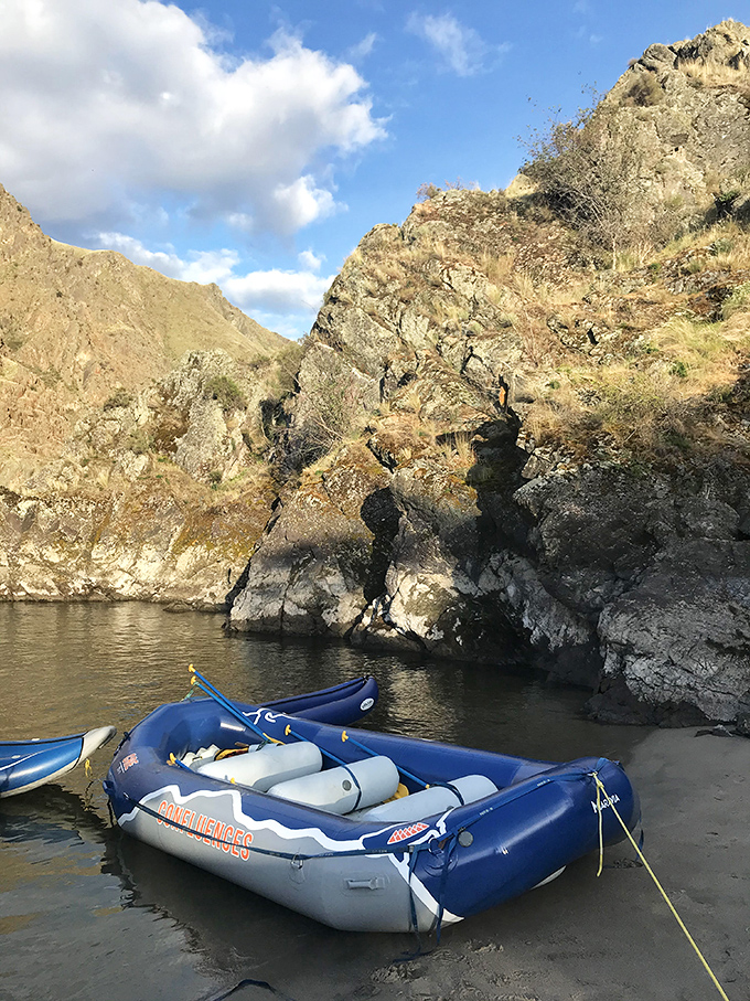 Parked and ready for river tales. This raft isn't just transportation&mdash;it's a floating front porch for experiencing Idaho's dramatic canyon landscapes.