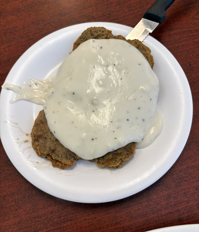 Country fried steak smothered in creamy gravy&mdash;Southern comfort food that gives you a warm hug from the inside out.