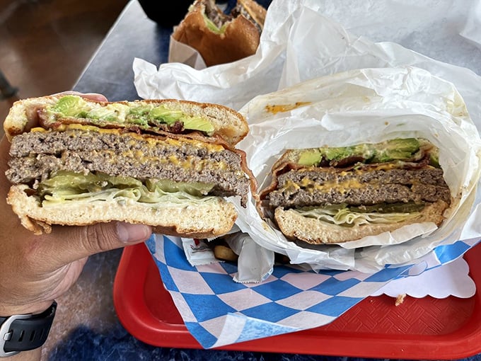 The double bacon avocado cheeseburger doesn't just satisfy hunger—it obliterates it with California-fresh ingredients between perfectly toasted buns.