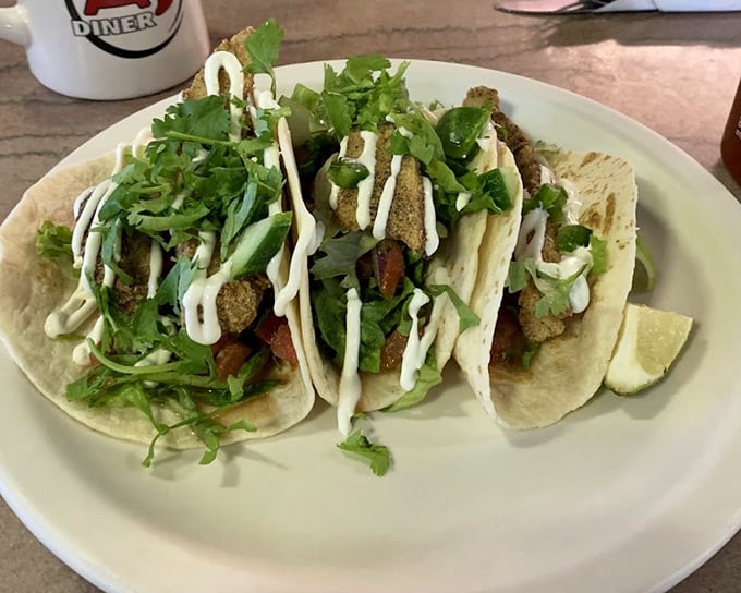 These aren't your average fish tacos. Fresh ingredients, thoughtful presentation, and a drizzle of sauce that ties everything together like a culinary bow.