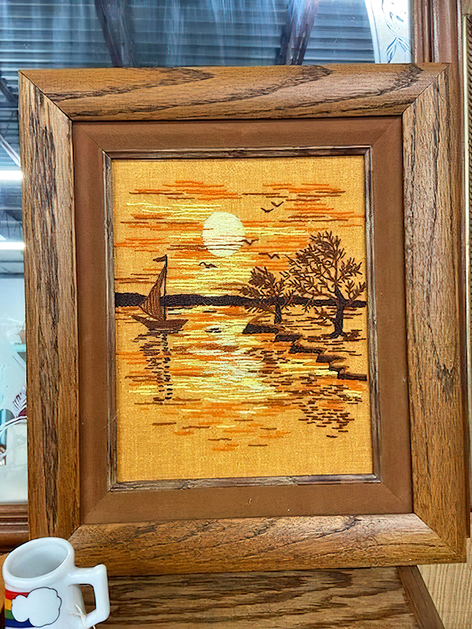 This embroidered sunset scene has probably outlived several living room color schemes and still looks ready for its moment in the spotlight.