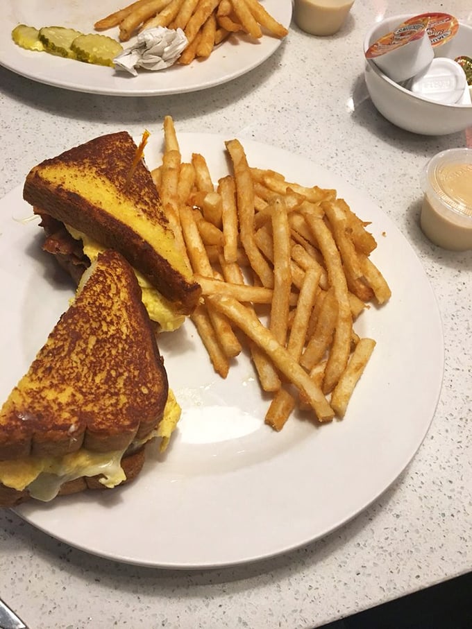 This grilled cheese isn't just lunch&mdash;it's therapy on a plate with a side of perfectly crisp fries that deserve their own fan club.