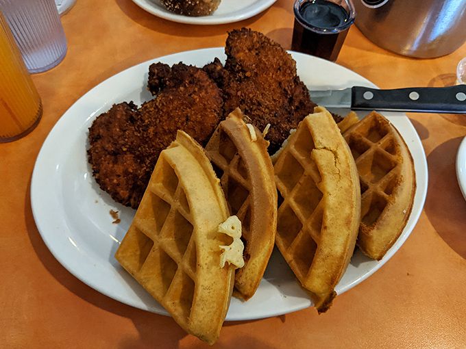 Golden-brown fried chicken alongside perfectly pressed waffles&mdash;proof that some of life's greatest relationships don't need to make logical sense.