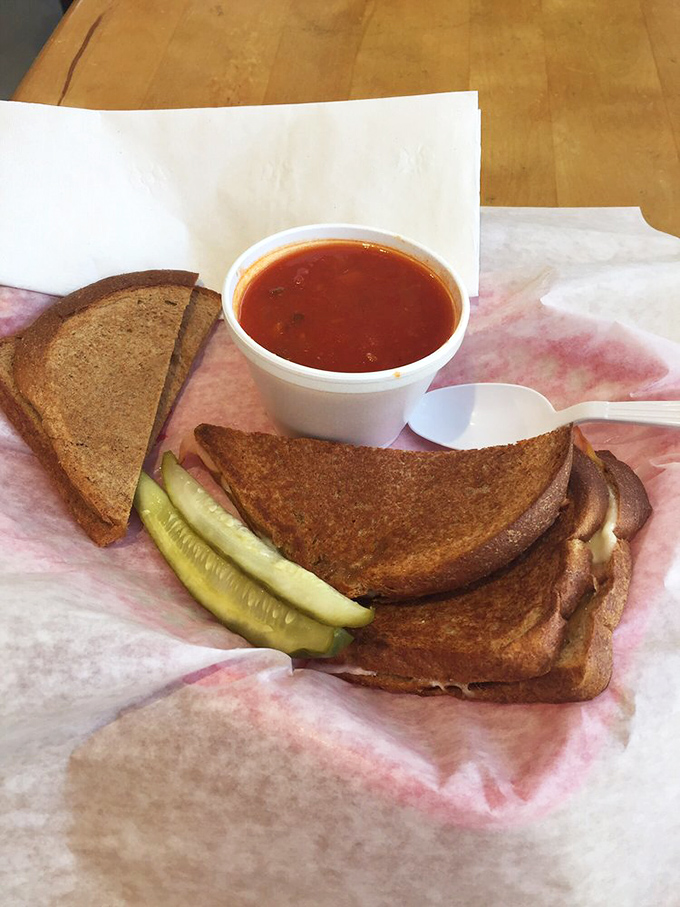 Grilled cheese and tomato soup: childhood comfort meets grown-up execution. The pickle adds that unexpected plot twist every good meal needs.