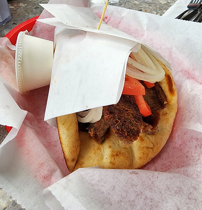 This isn't just a gyro &ndash; it's edible architecture, with layers of meat, veggies, and sauce creating a handheld masterpiece of Mediterranean flavors.