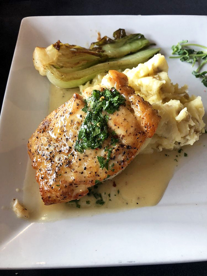 This halibut doesn't just swim in the ocean&mdash;it swims in butter and herbs before landing gracefully beside those fluffy mashed potatoes.