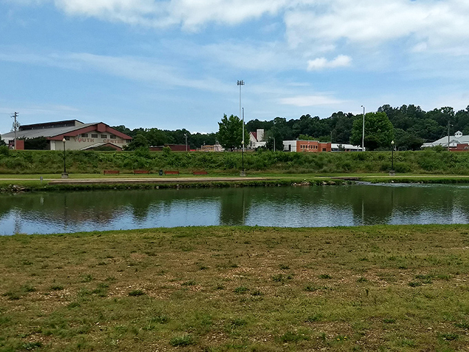 A serene pond reflects Harrison's small-town skyline, proving that waterfront property doesn't have to come with big-city price tags.