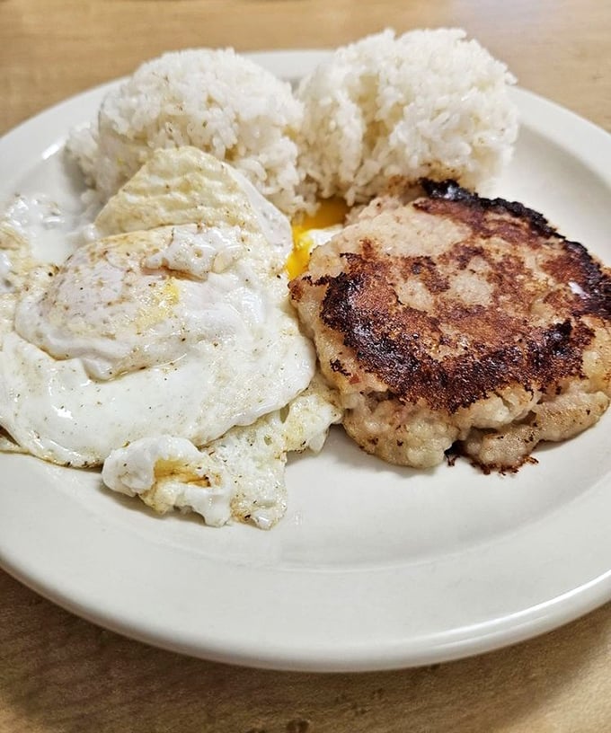 Breakfast perfection doesn't need fancy plating. Two scoops rice, eggs with that perfect runny yolk, and a hamburger patty that means business.