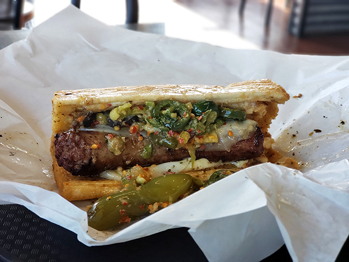 This Italian sausage sandwich isn't just food – it's architecture. The structural integrity of that bread holding up against the giardiniera deserves an engineering award.