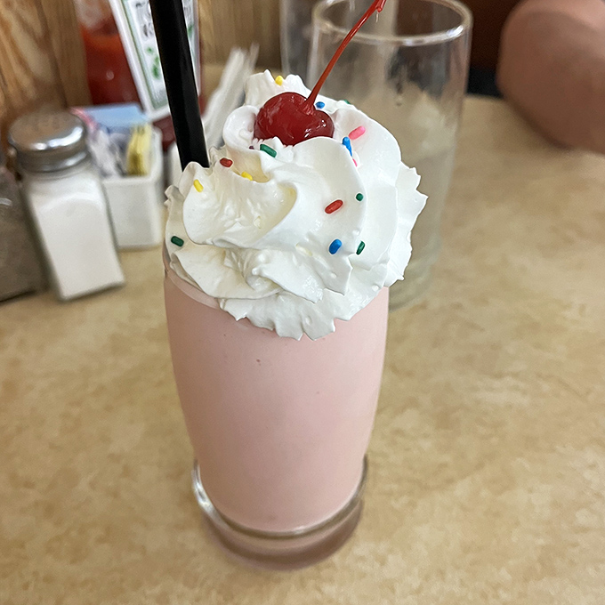 This strawberry shake isn't playing around. Topped with real whipped cream, sprinkles, and a cherry, it's what childhood dreams and adult indulgences are made of.